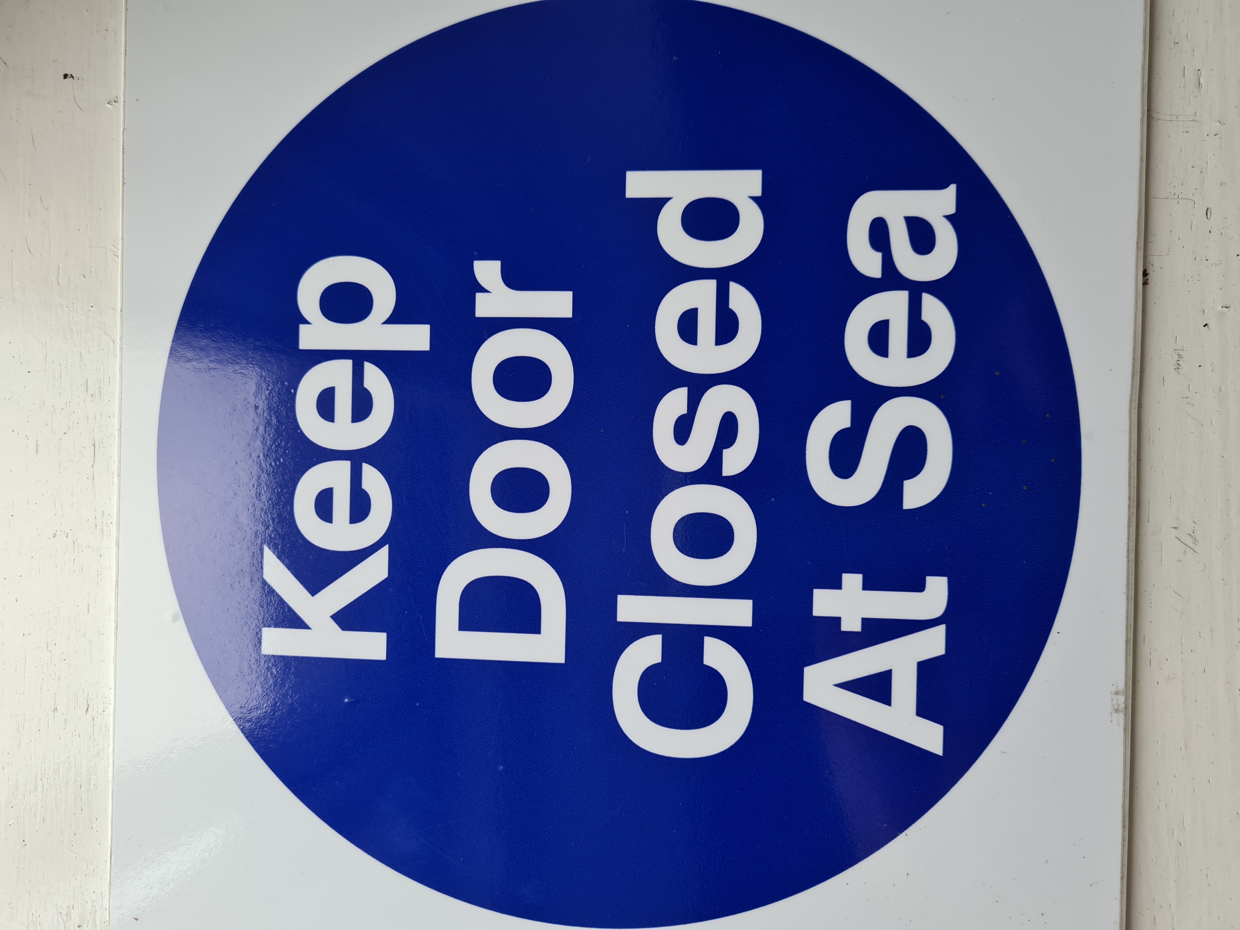 KEEP CLOSED AT SEA SIGN